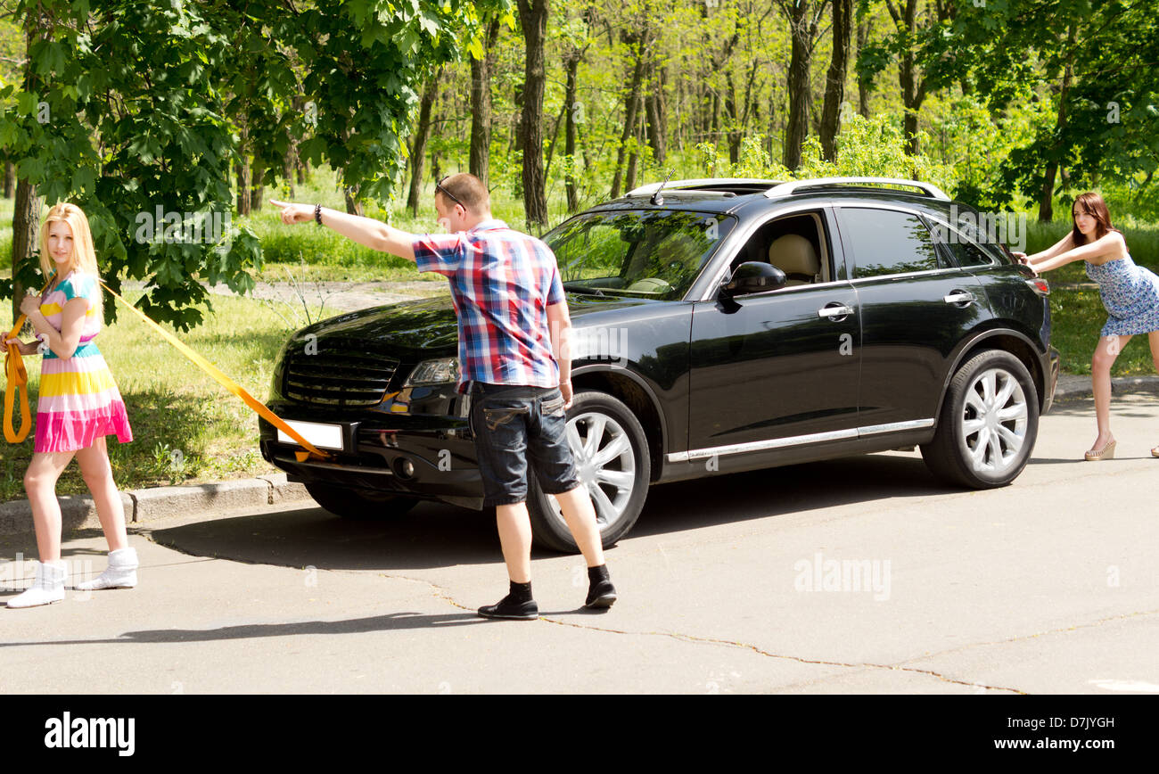 Man pulling car rope hi-res stock photography and images - Alamy