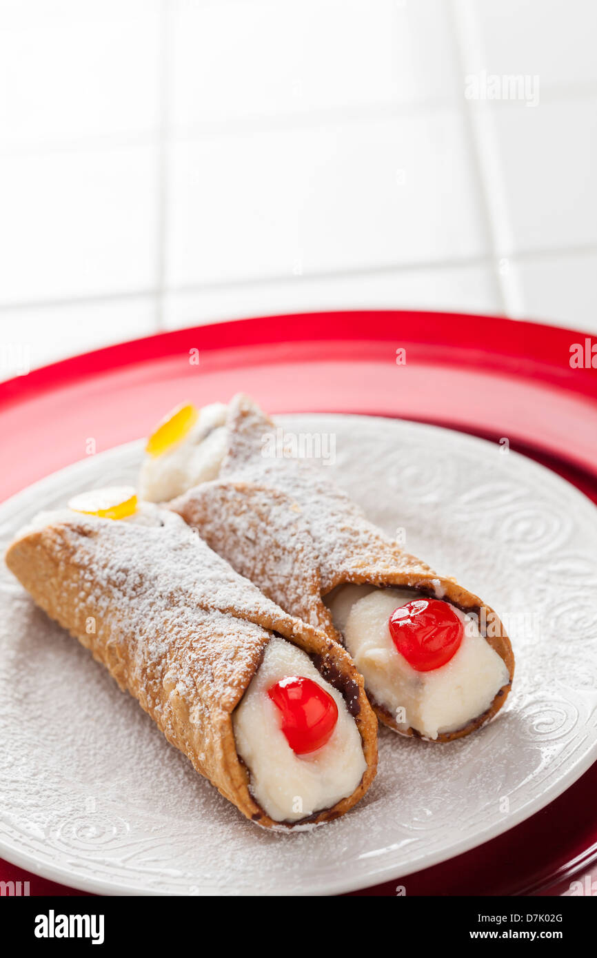 Two Tasty Cannoli on a Plate Stock Photo - Alamy