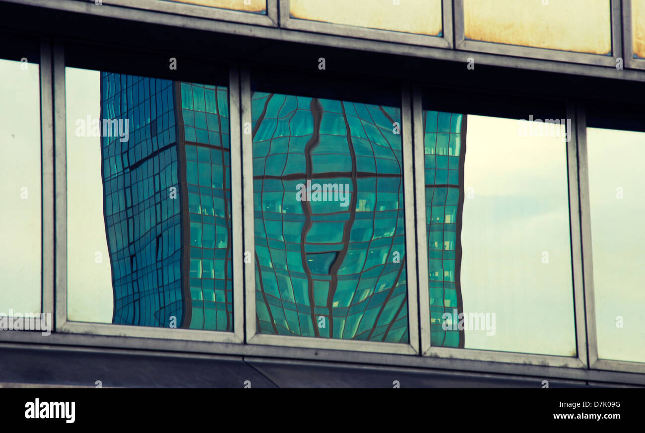 Funny reflection of the another building in windows Stock Photo - Alamy