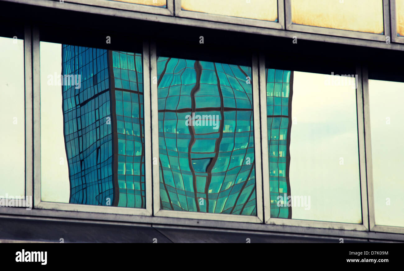 Funny reflection of the another building in windows Stock Photo - Alamy