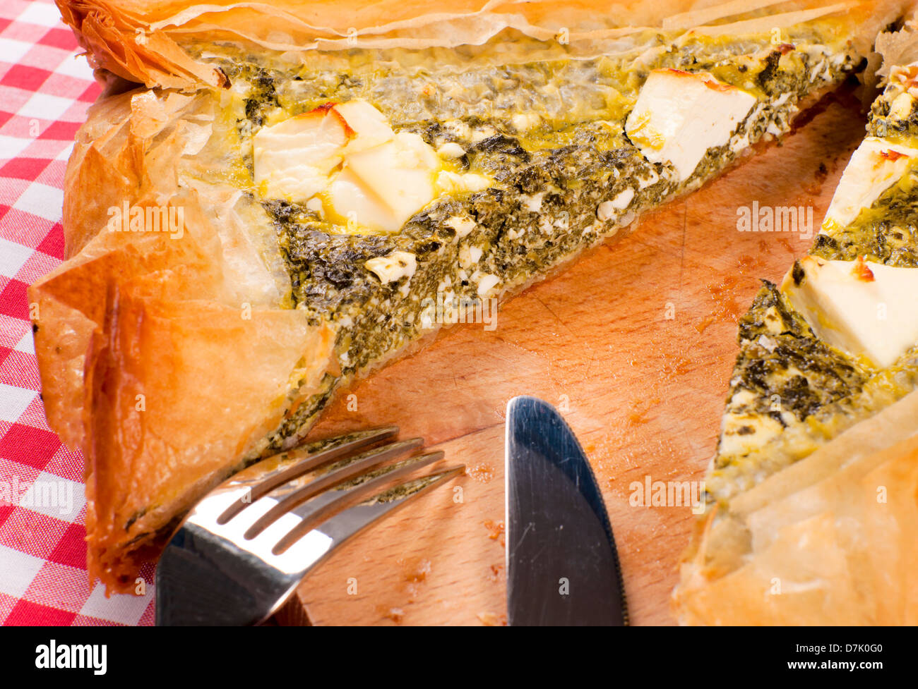 Traditional greek pie with feta cheese and spinach Stock Photo - Alamy