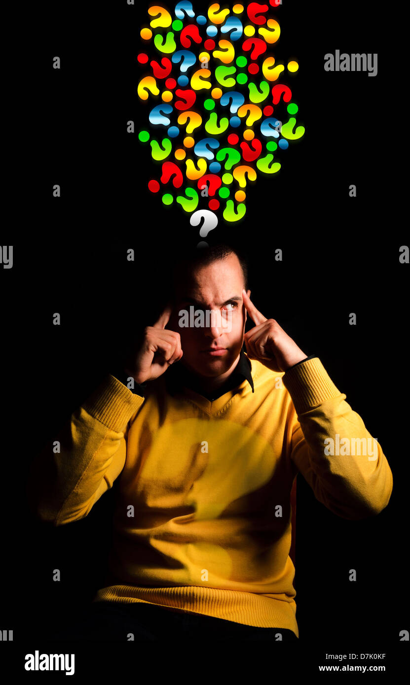 Man with his finger on head thinking. Shoot in low key technique Stock ...