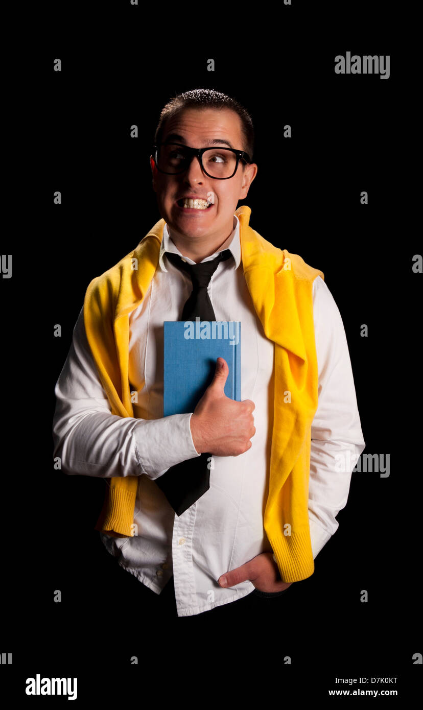 The wise student with blue book in his hand. Shoot in low key technique ...