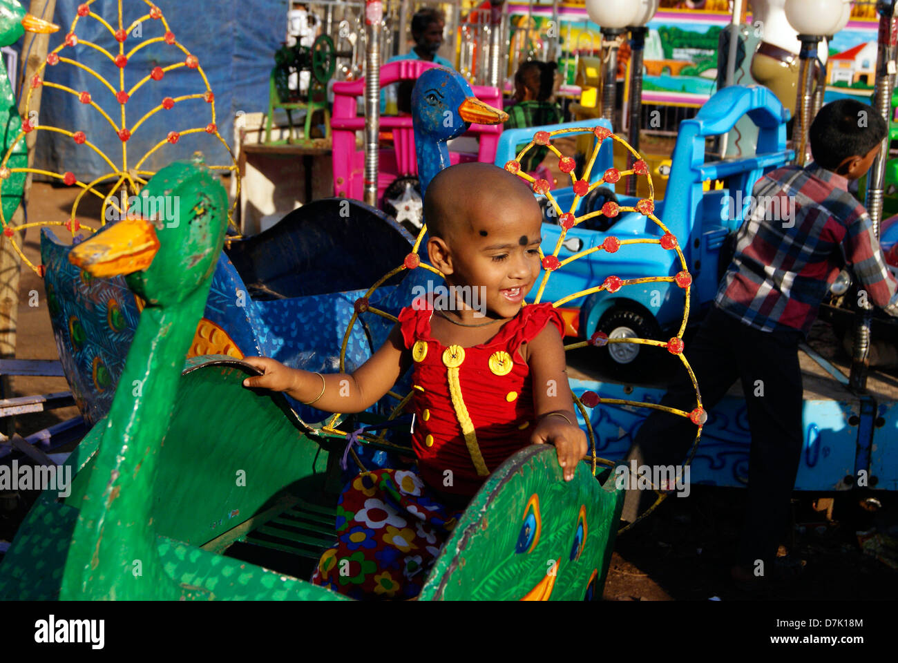 Village Child Girl India Enjoying Local Amusement park funny ride in ...