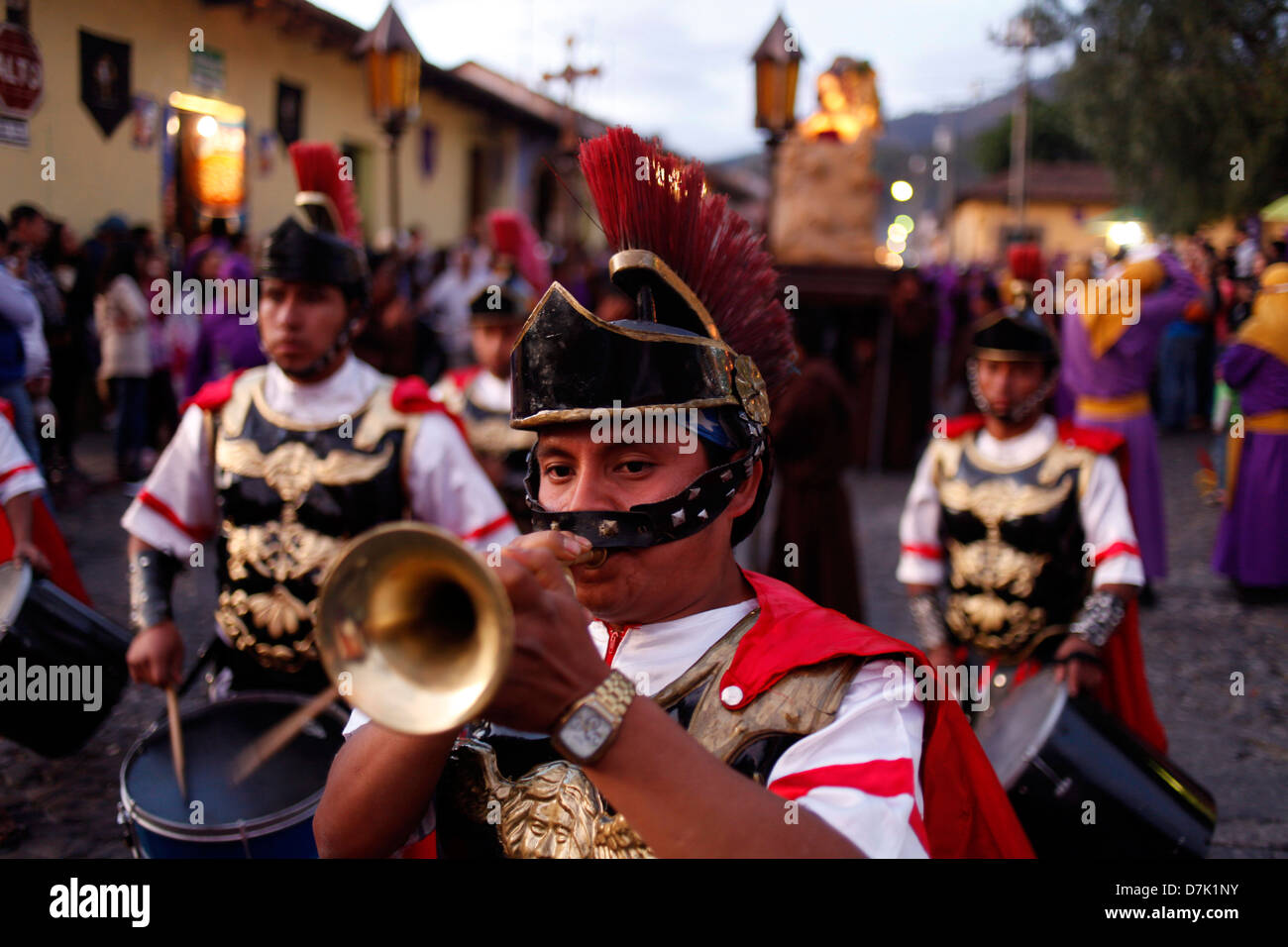 A man dressed as a Roman legionary plays a bugle trumpet during Semana ...