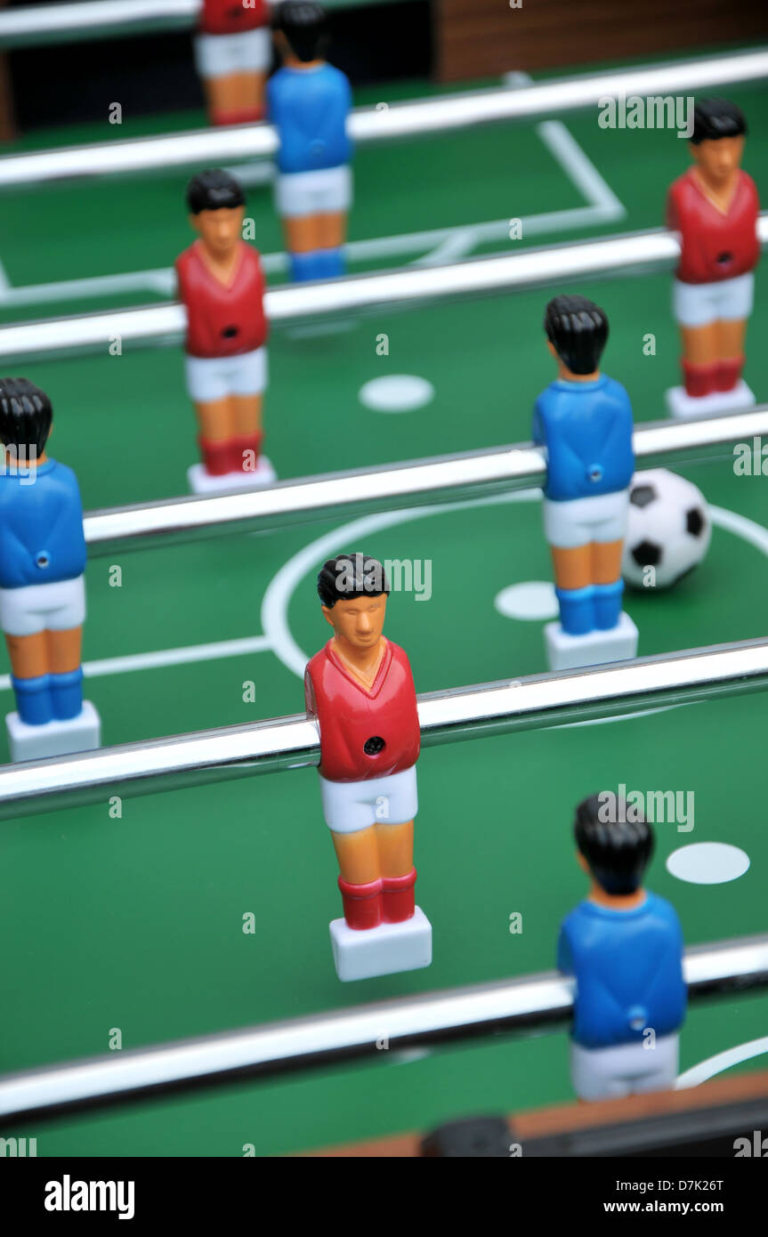Red and blue players from table top football game, to emphasise ...