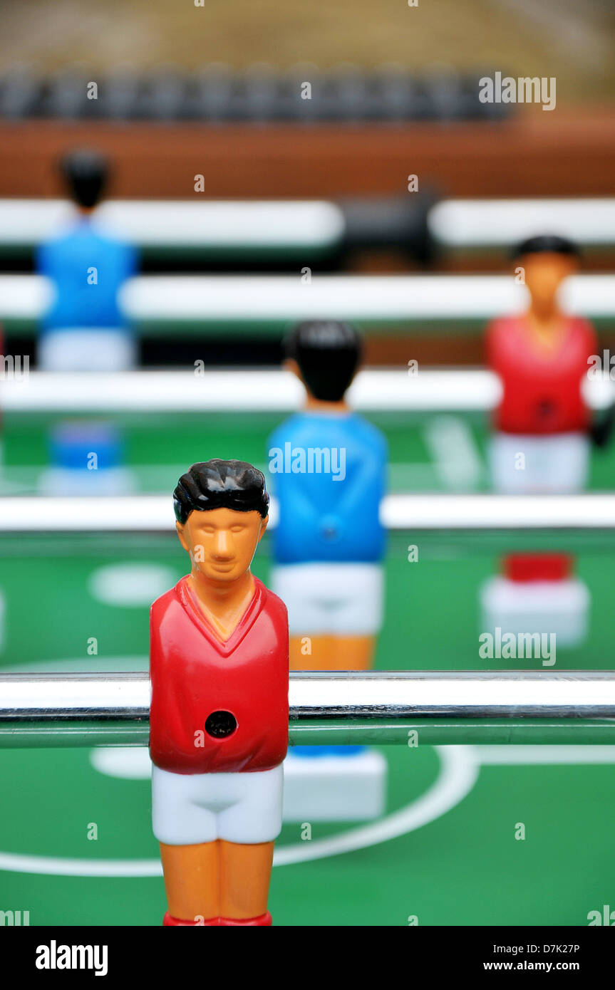 Red and blue players from table top football game, to emphasise ...