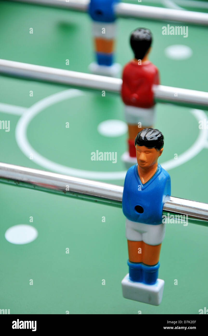 Red and blue players from table top football game, to emphasise ...