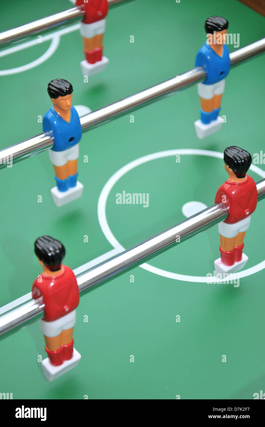 Red and blue players from table top football game, to emphasise ...