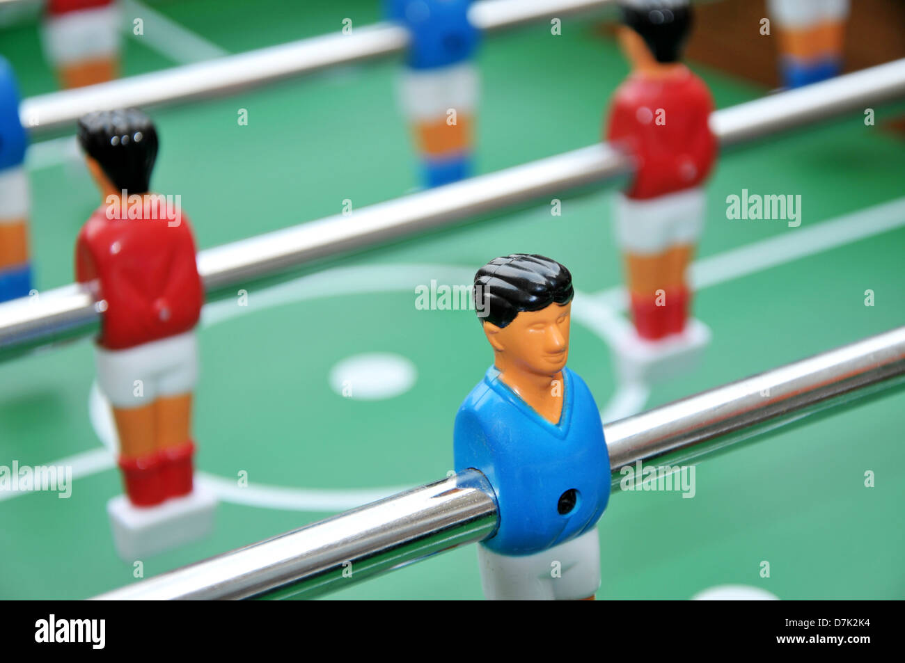 Red and blue players from table top football game, to emphasise ...