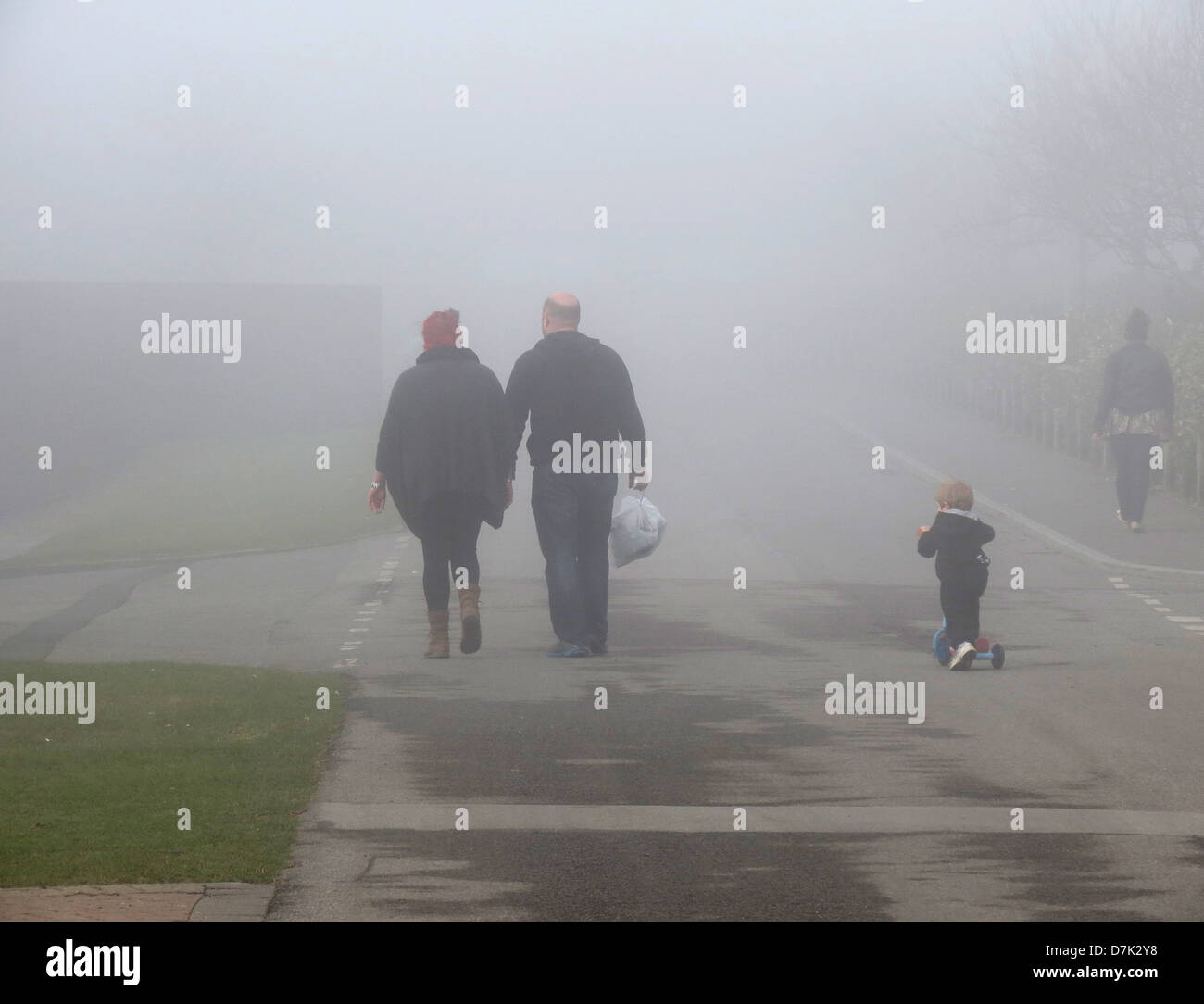 People walking in misty conditions Stock Photo - Alamy