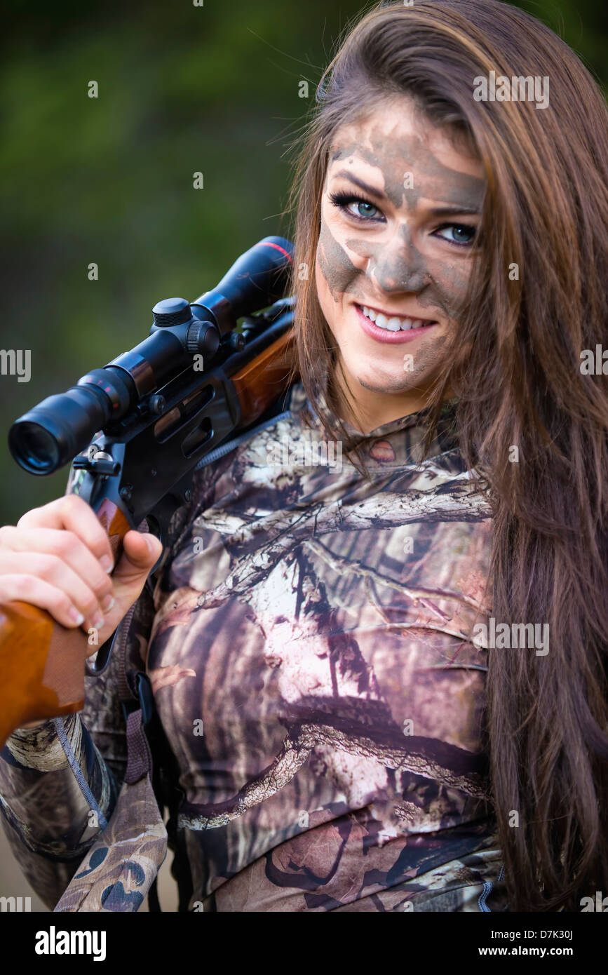 USA, Texas, Young woman with hunting rifle, smiling Stock Photo - Alamy