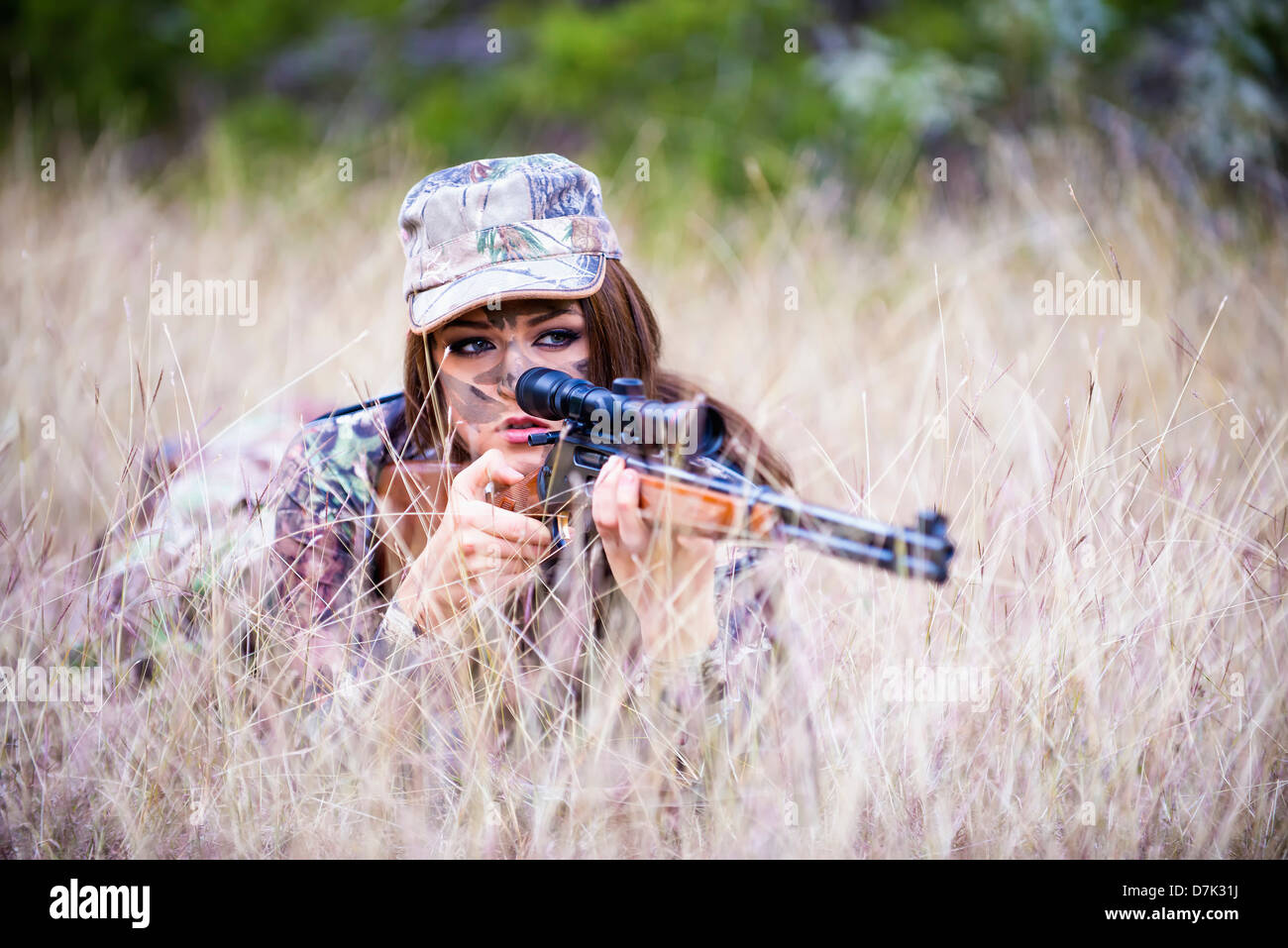 USA, Texas, Young woman with hunting rifle Stock Photo - Alamy