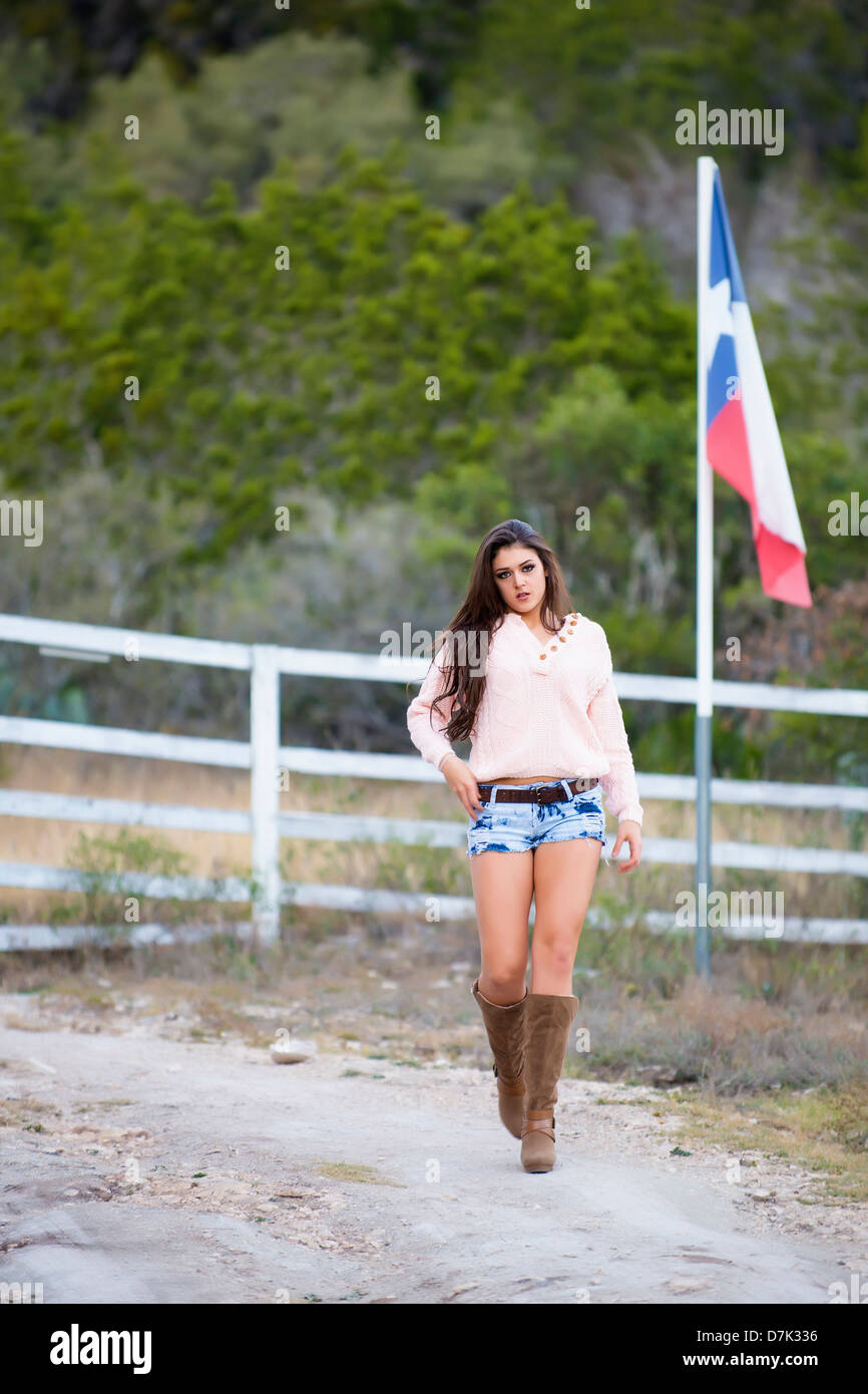 USA, Texas, Cowgirl walking on ranch Stock Photo - Alamy