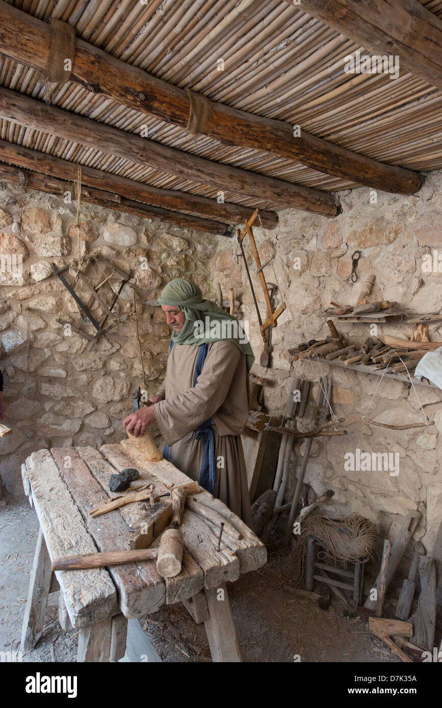 Carpenter at work at a reconstruction of a First Century Israeli ...