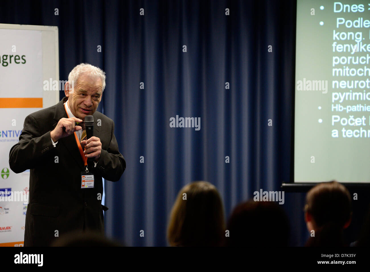An older man giving a lecture Stock Photo - Alamy
