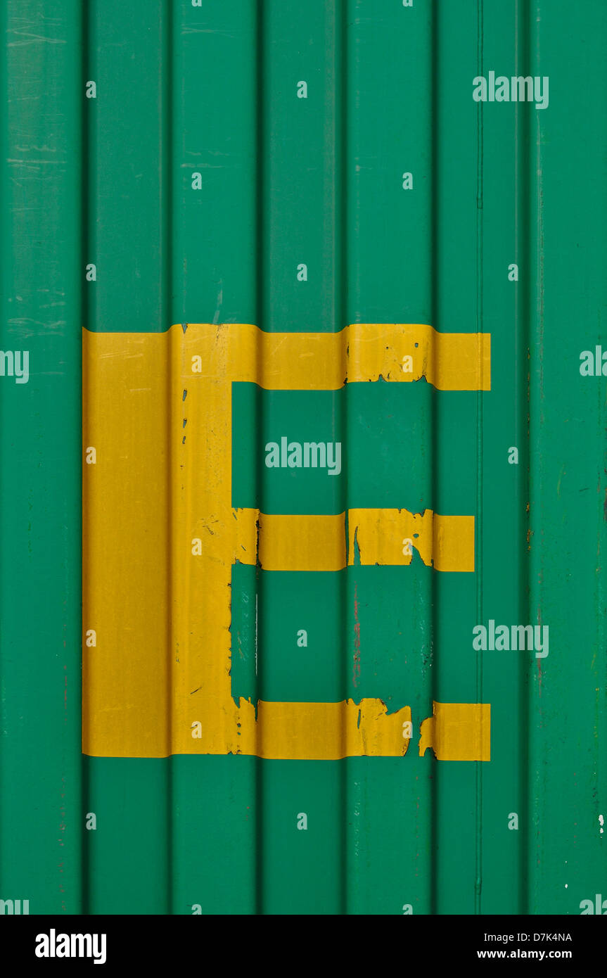 Germany, Yellow coloured letter E on green painted container Stock ...