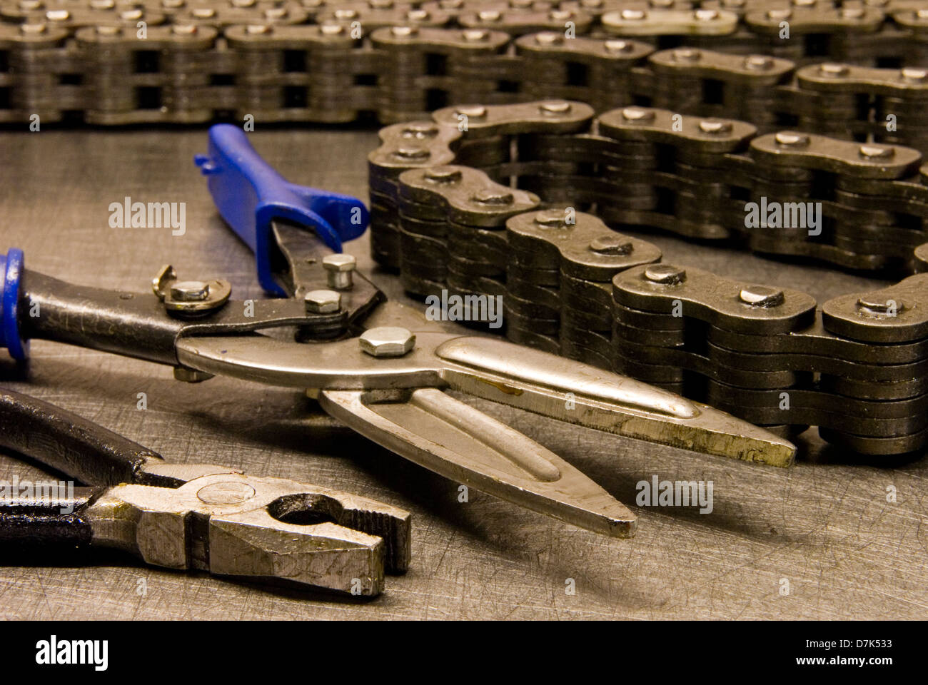 tools for chain repairs on inspection Table Stock Photo - Alamy