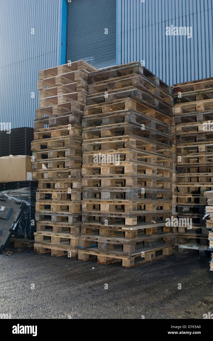 pallets stacked in warehouse yard Stock Photo - Alamy