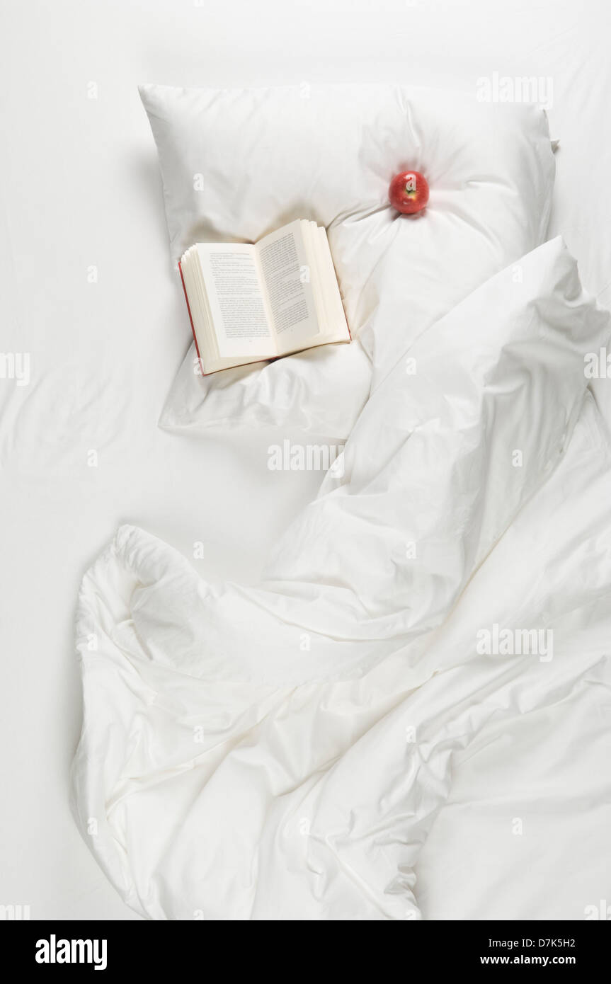 Book with apple on bed hi-res stock photography and images - Alamy
