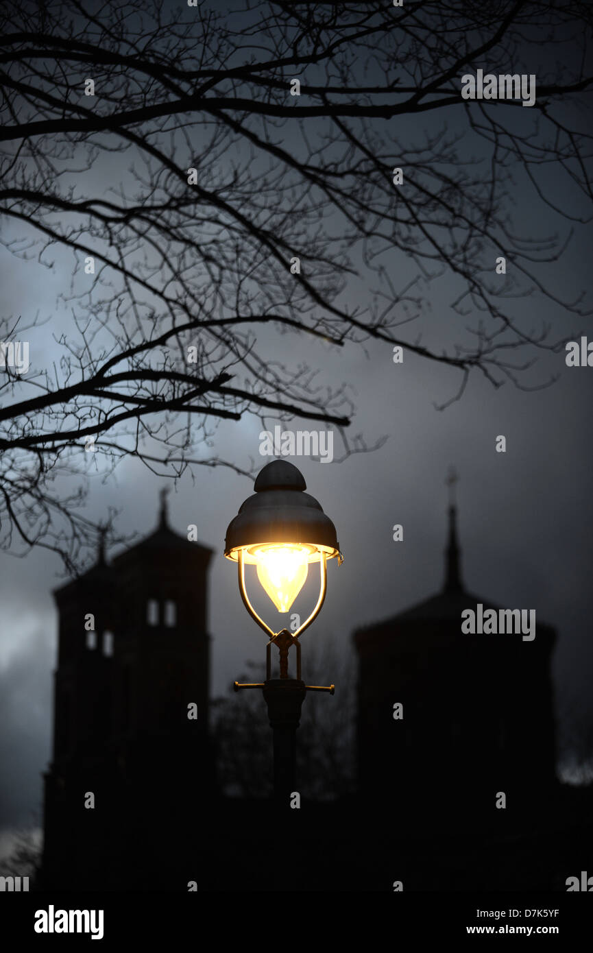 Berlin, Germany, glowing gas lantern in the evening in the streets of ...