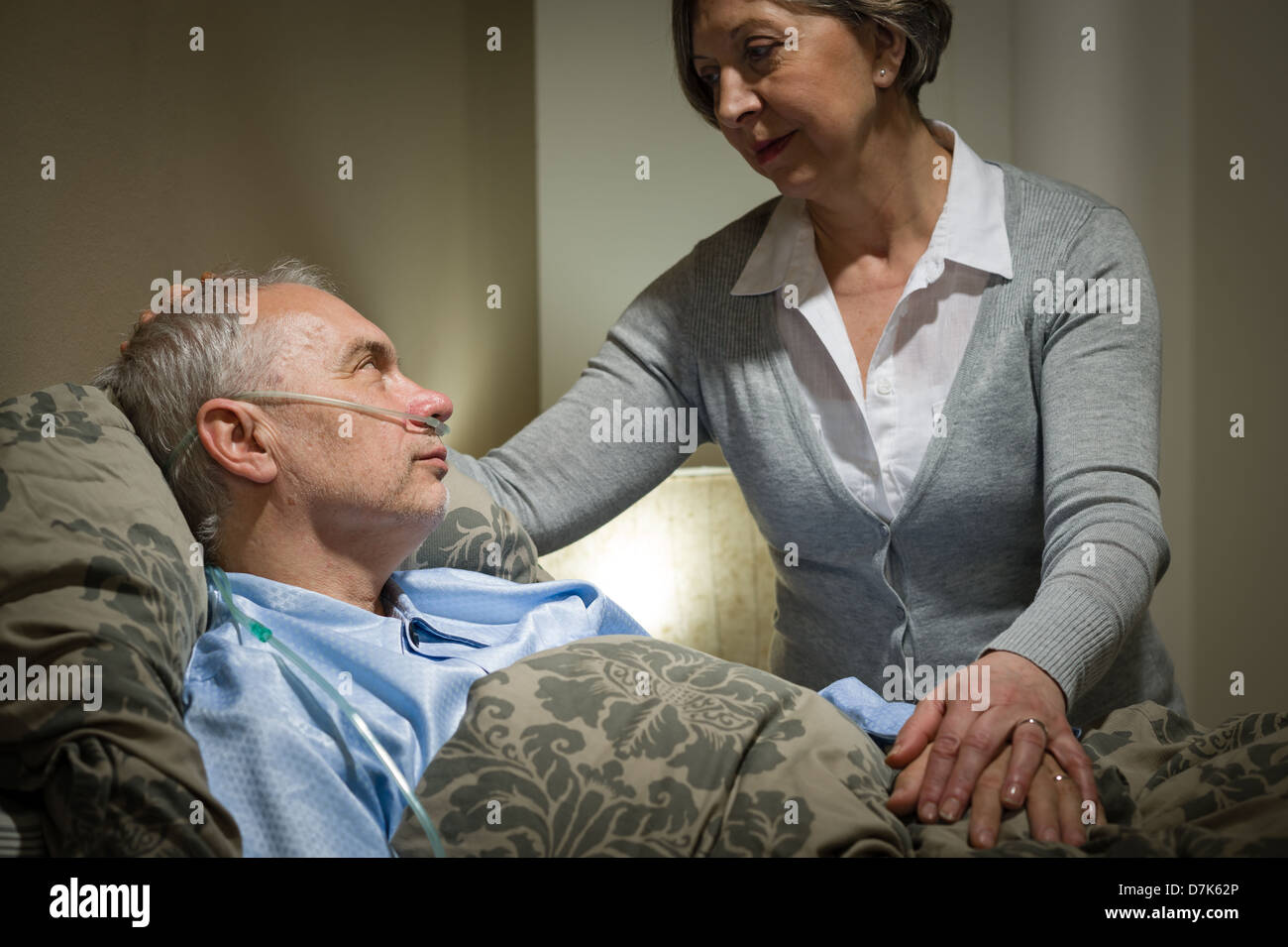 Old woman in sick bed hi-res stock photography and images - Alamy
