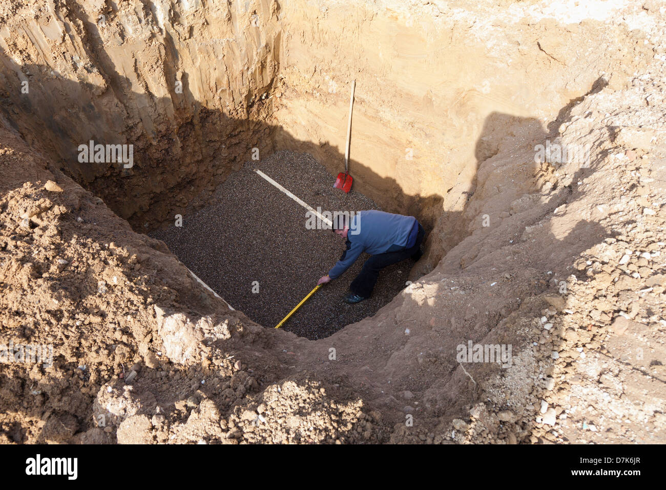 Europe, Germany, Rhineland Palatinate, Mature man measuring pit for ...