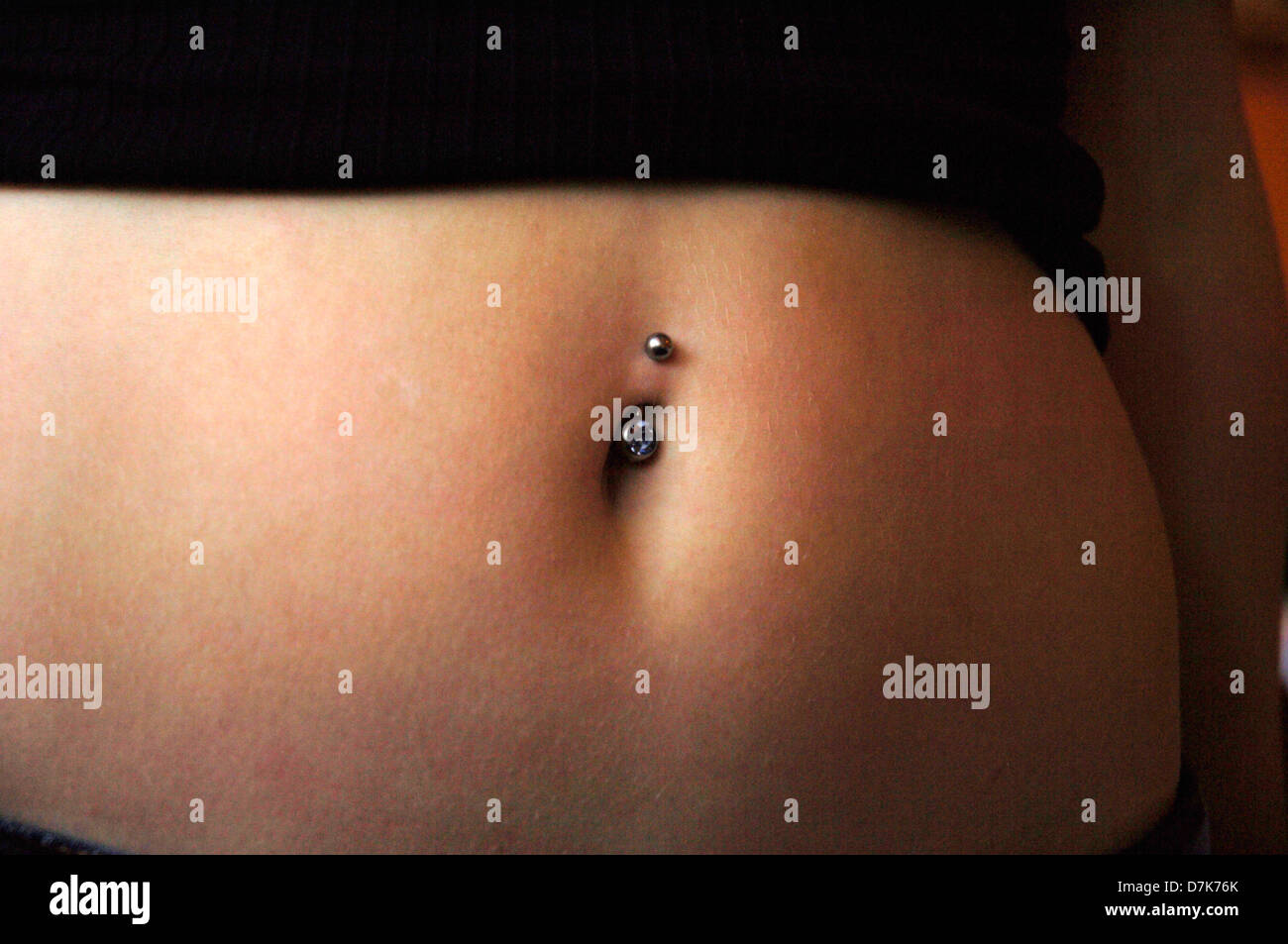Belly piercing hi-res stock photography and images - Alamy