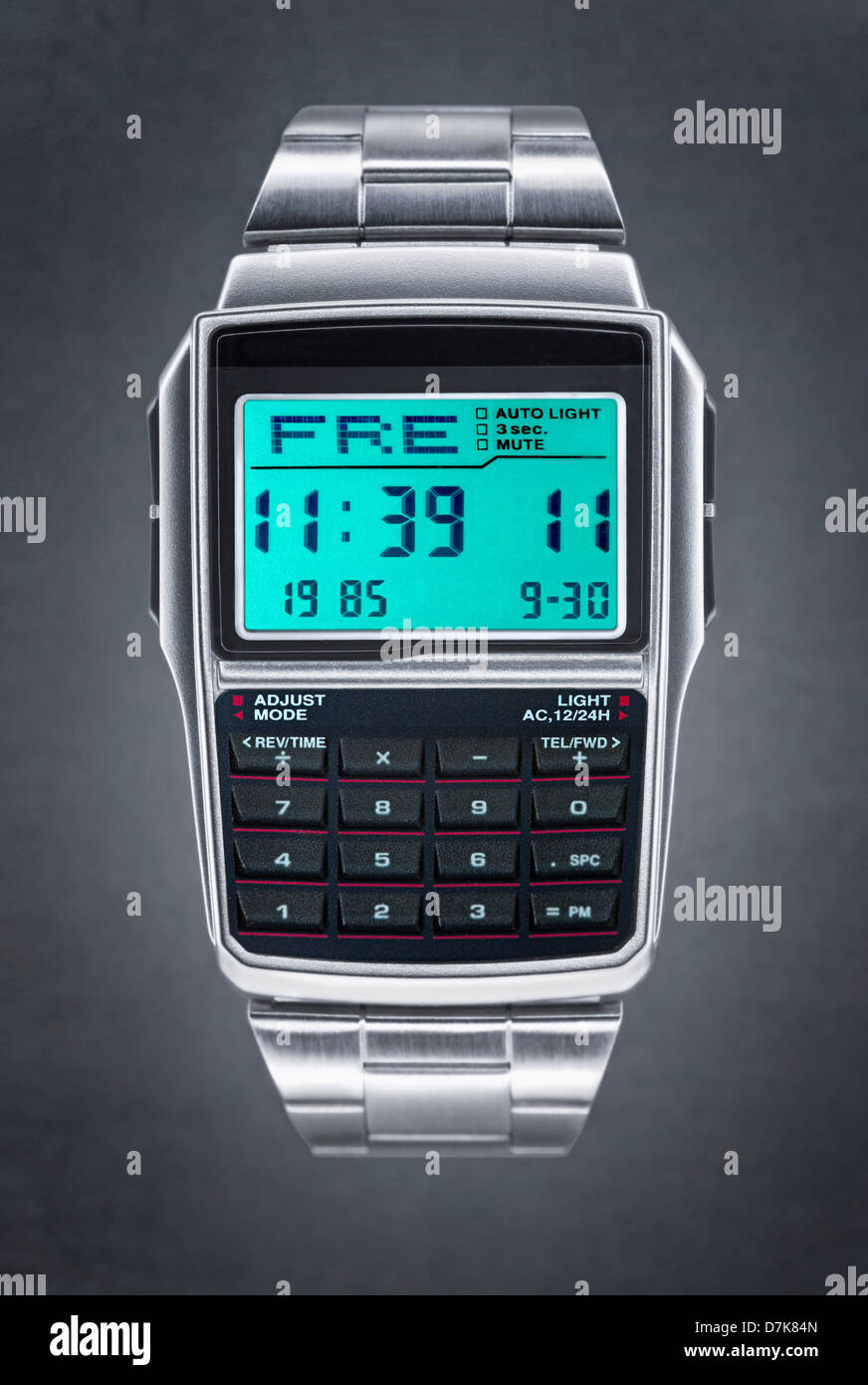 Digital Clock with calculator against black background, close up Stock ...