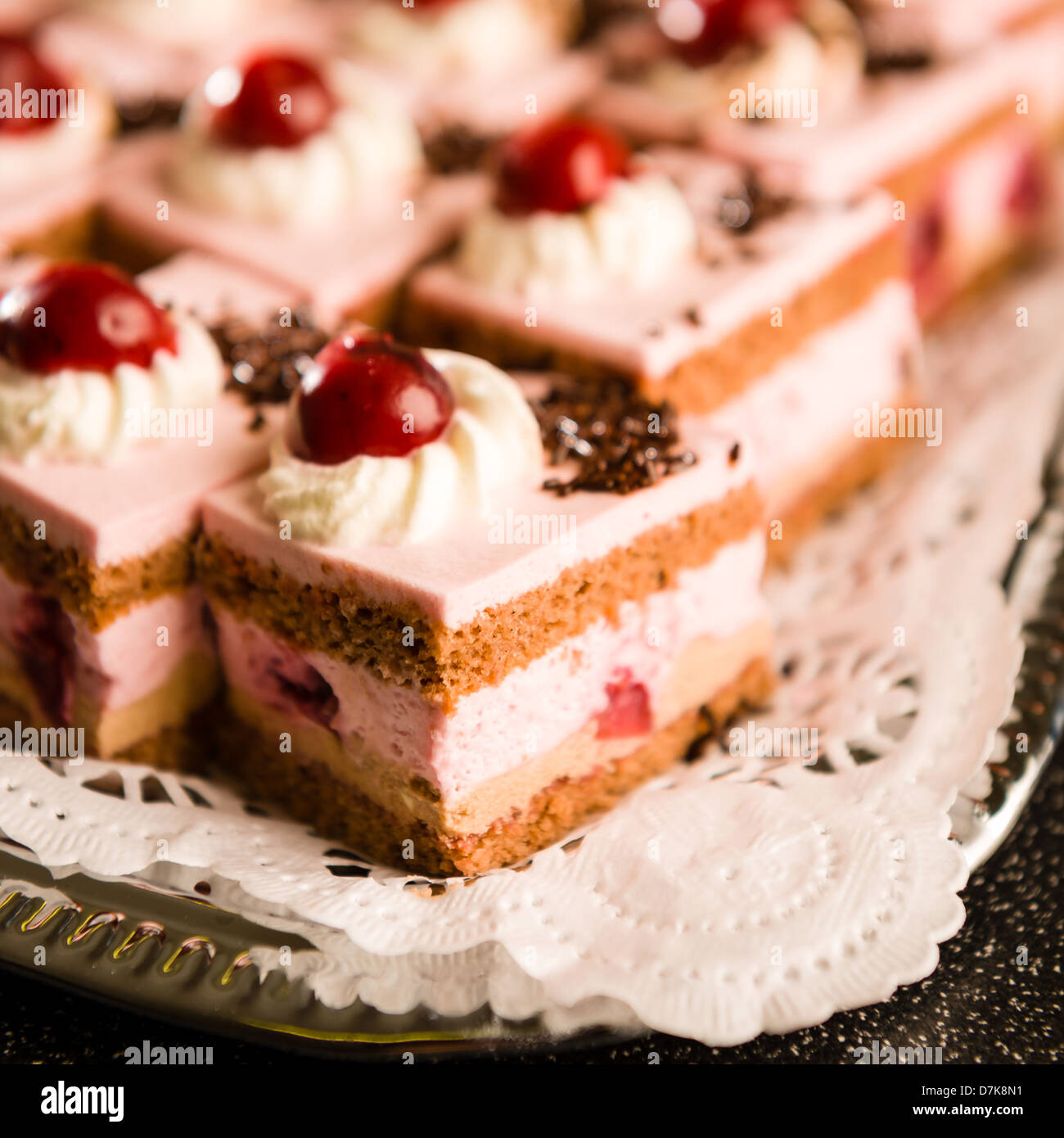 Cherry cream filled sponge cakes with whipped cream topping Stock Photo ...