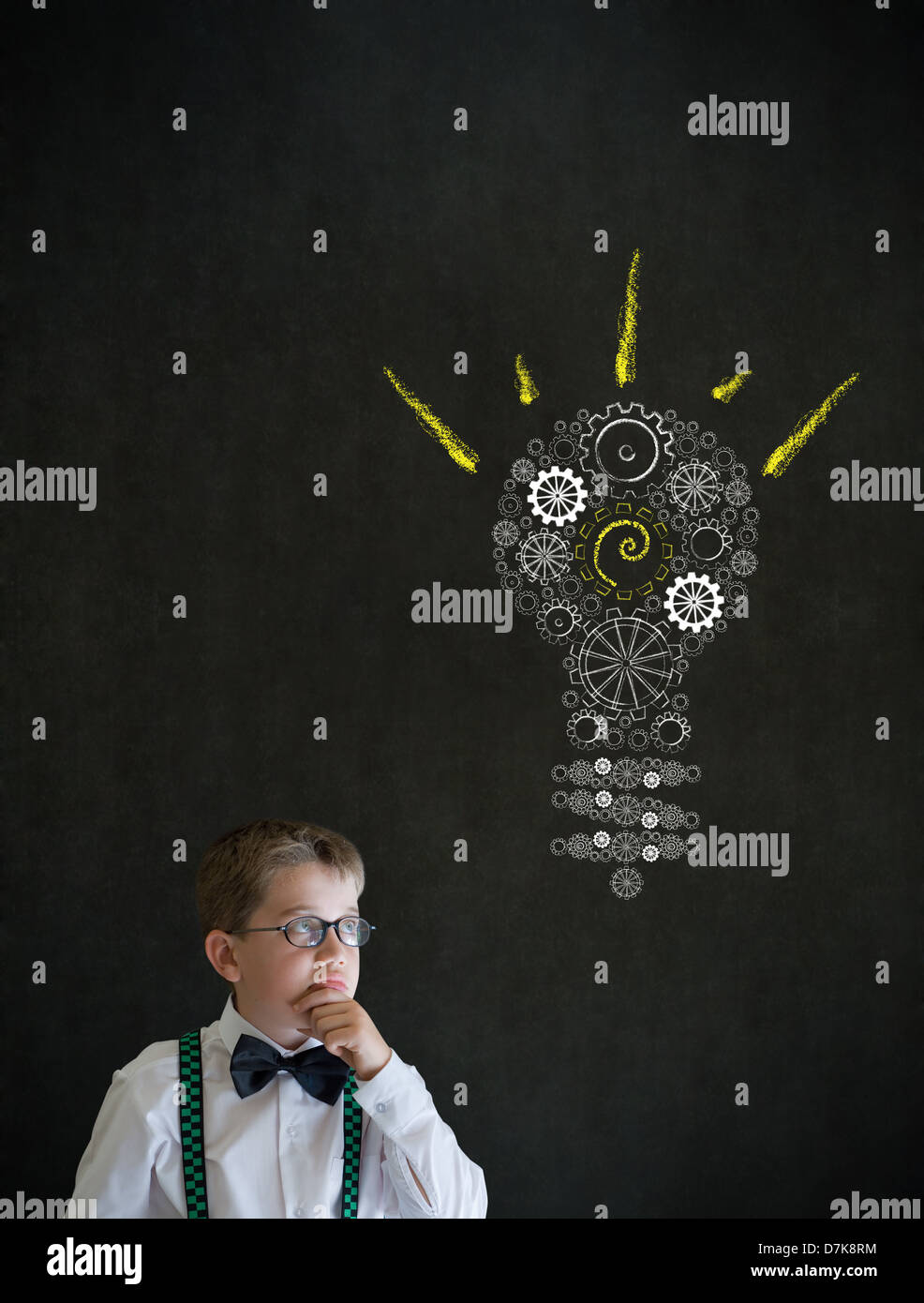 Thinking boy dressed up as business man with bright idea gear cog ...