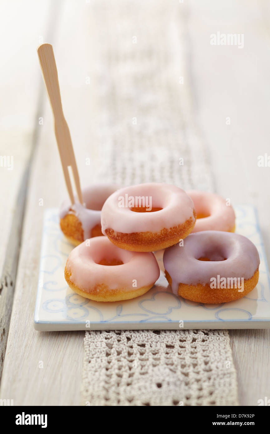 Glazed baked doughnuts on tile Stock Photo - Alamy