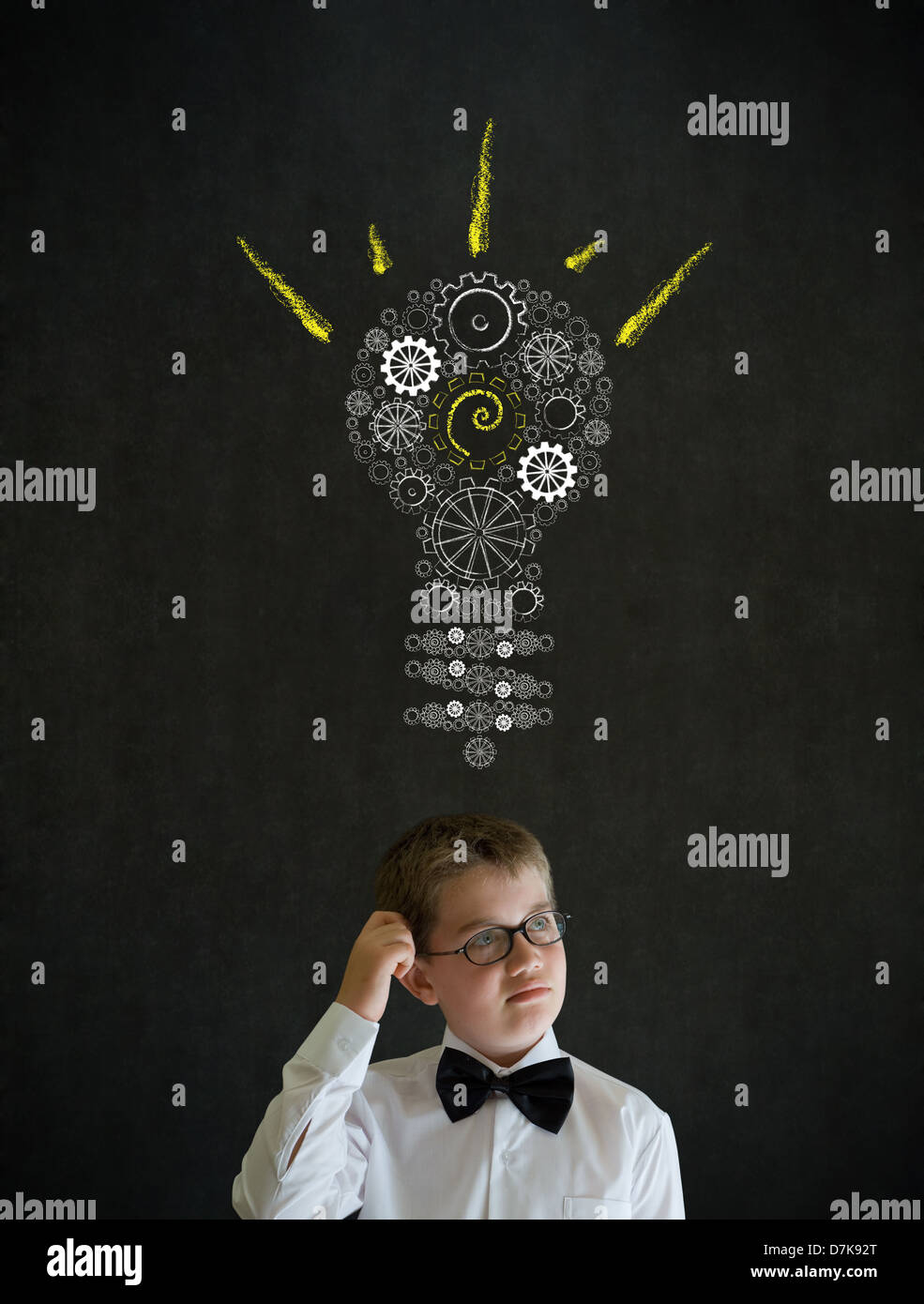 Scratching head thinking boy dressed up as business man with bright ...