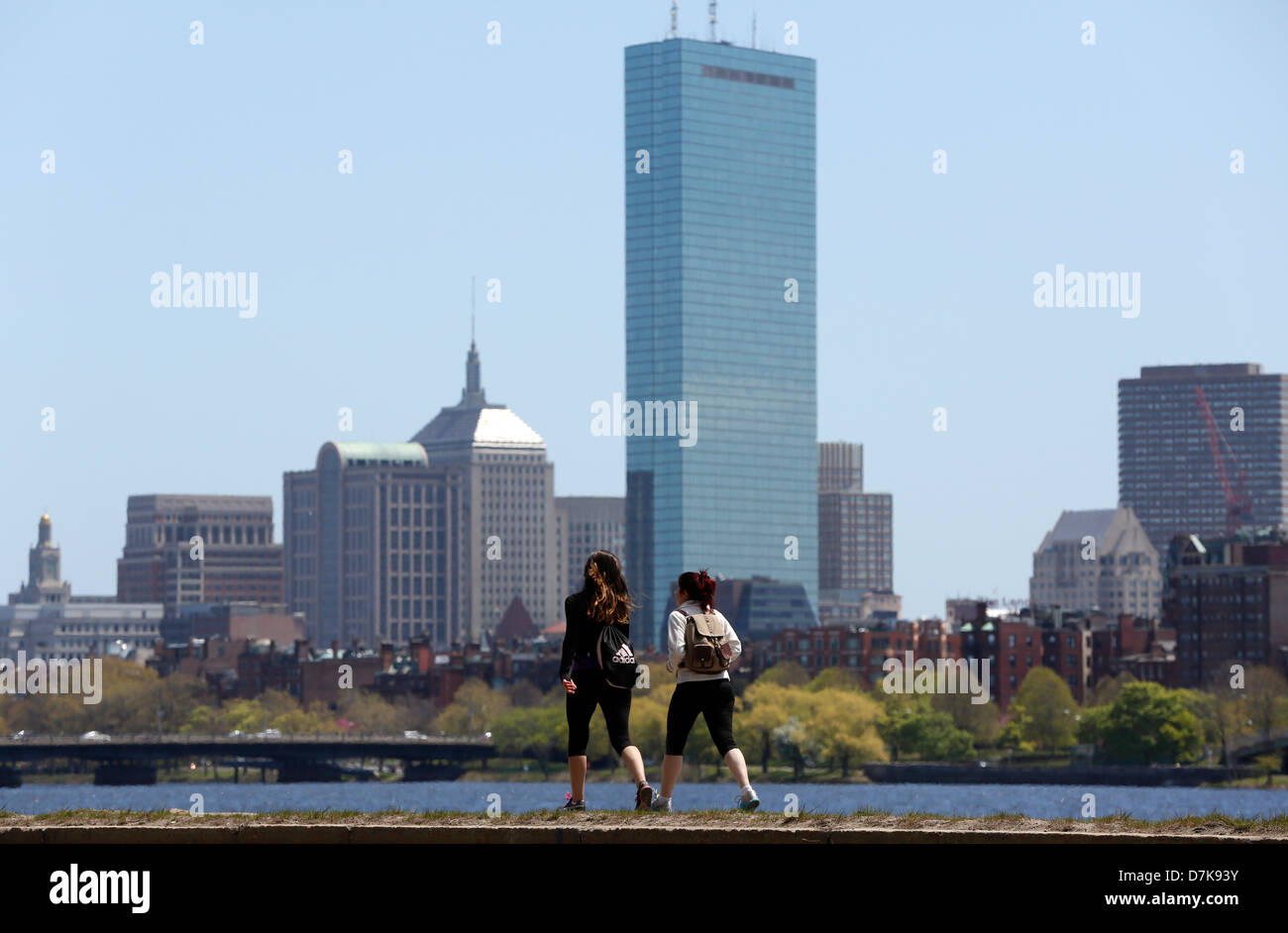 People walking along the Charles River in Cambridge, Massachusetts with ...