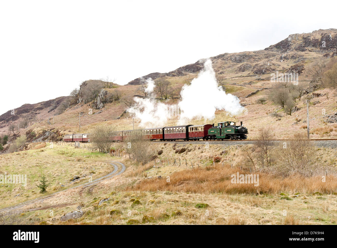 Steam locomotive pulling a passenger train on the Welsh Highland line ...