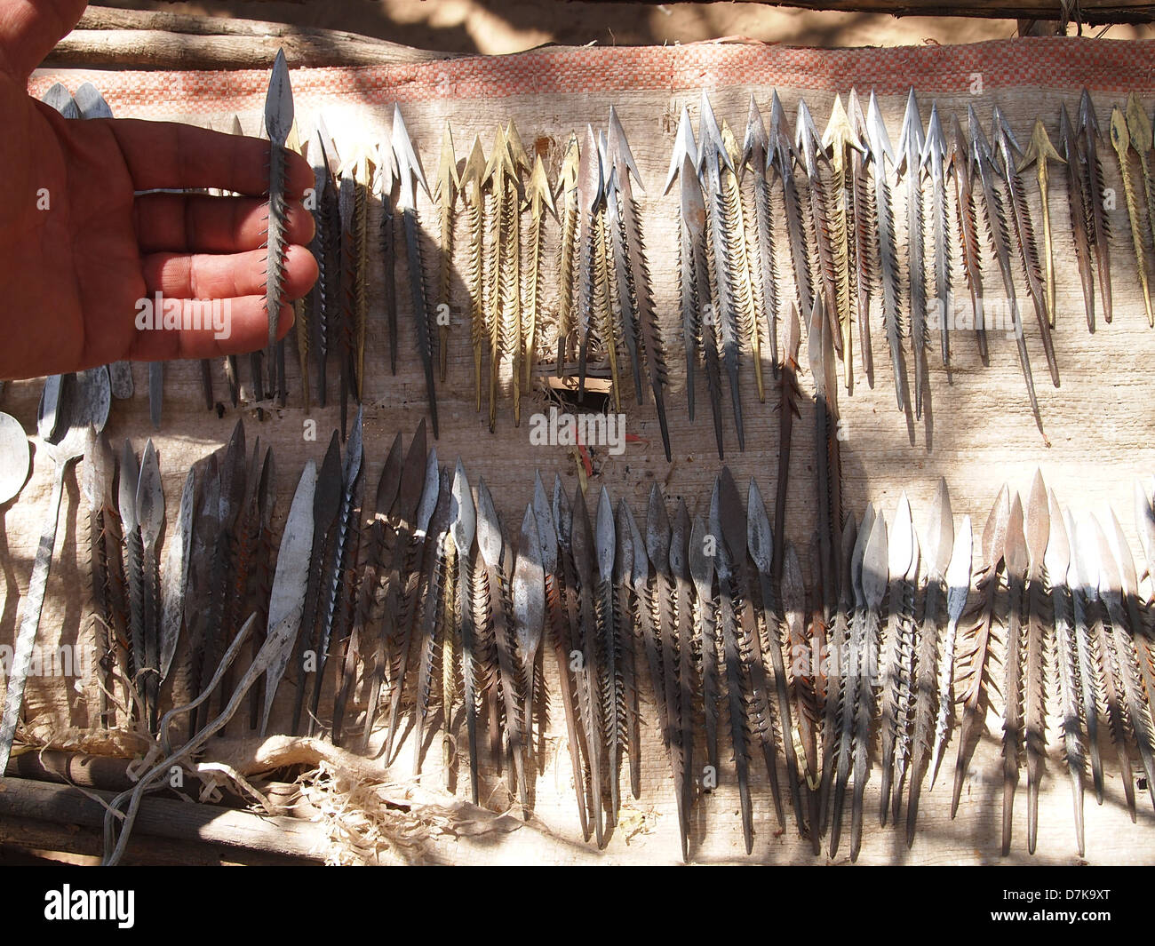 Men of Datoga tribe make lots of arrows Stock Photo - Alamy