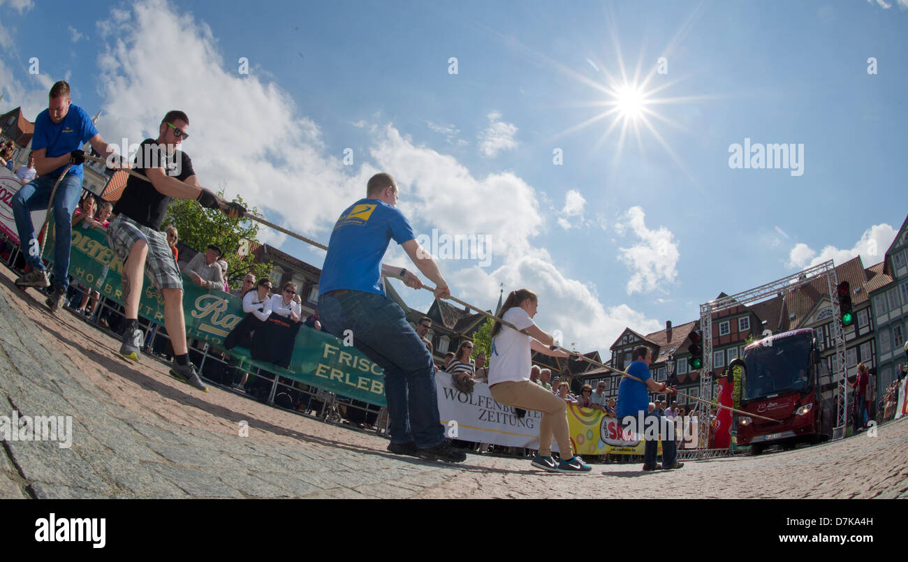A team pulls a coach during the 11th bus pulling championships in ...