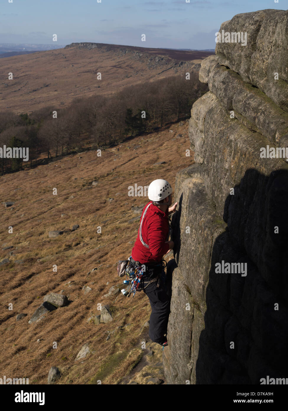 Climbers on Stanage Edge in the Peak District National Park Derbyshire ...