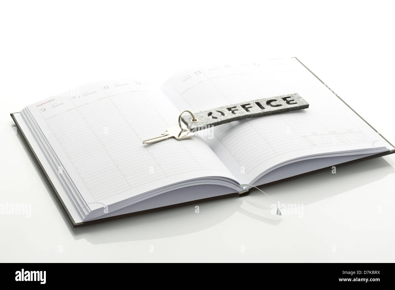 Close up of office key and appointment book on white background Stock ...