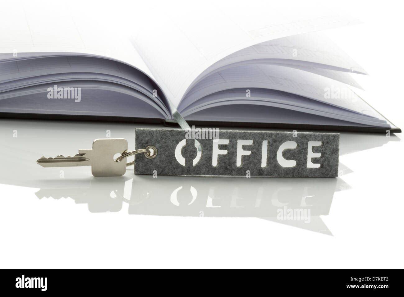Close up of office key and appointment book on white background Stock ...