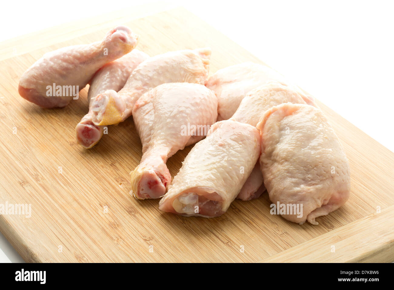 Chicken pieces on chopping board, close-up Stock Photo - Alamy