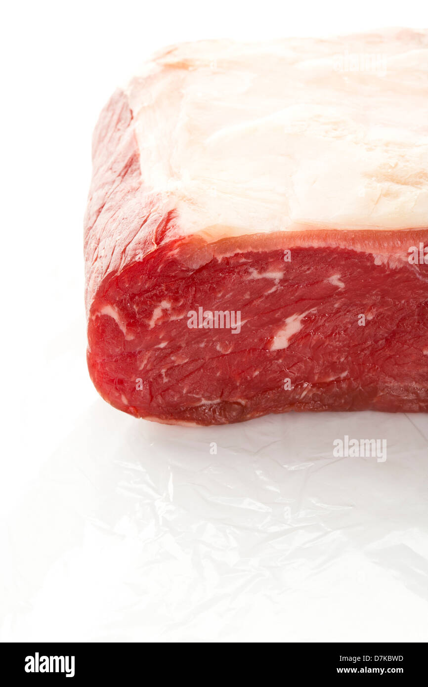 Raw beef on white background, close-up Stock Photo - Alamy