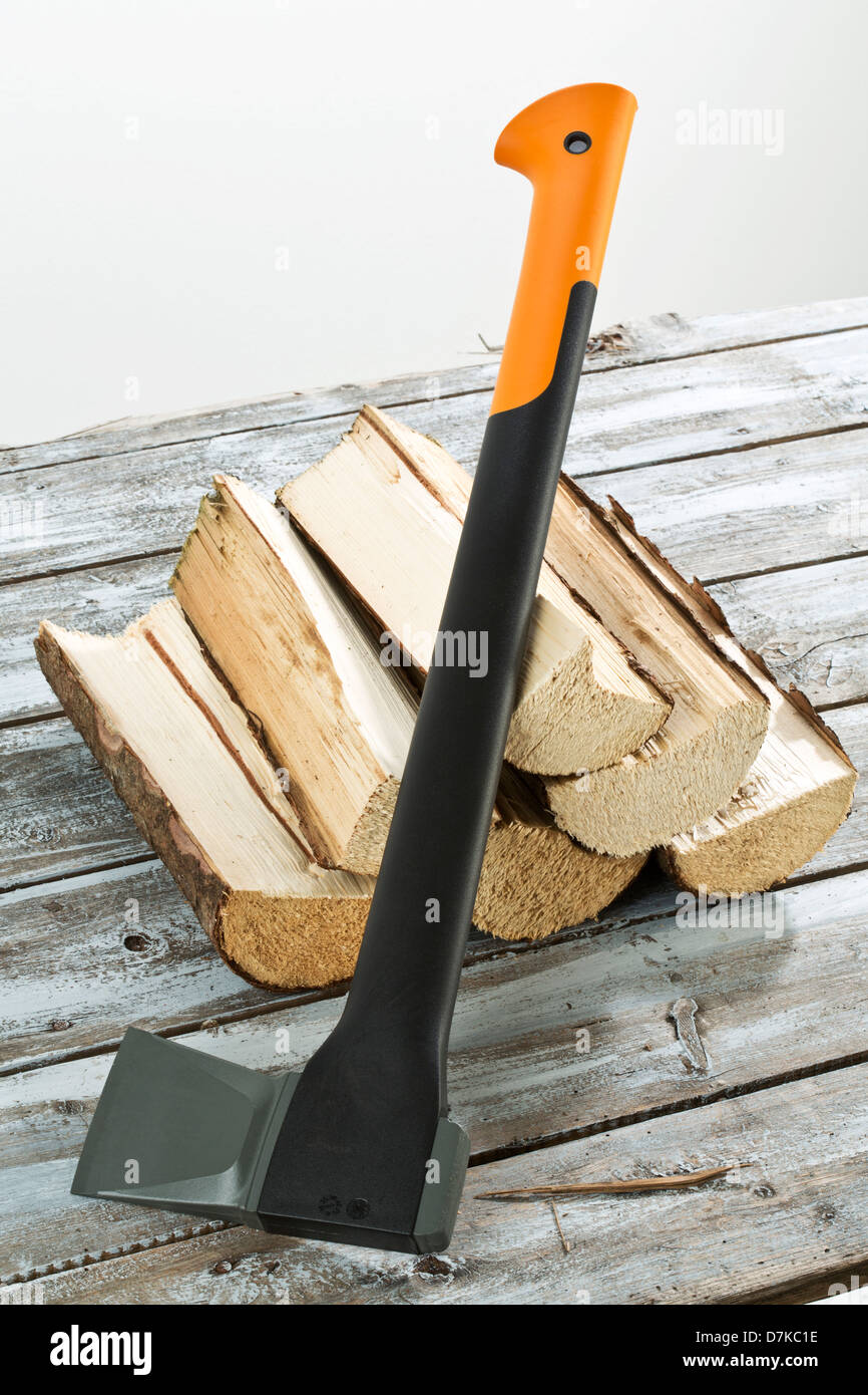 Axe with wood stack Stock Photo - Alamy
