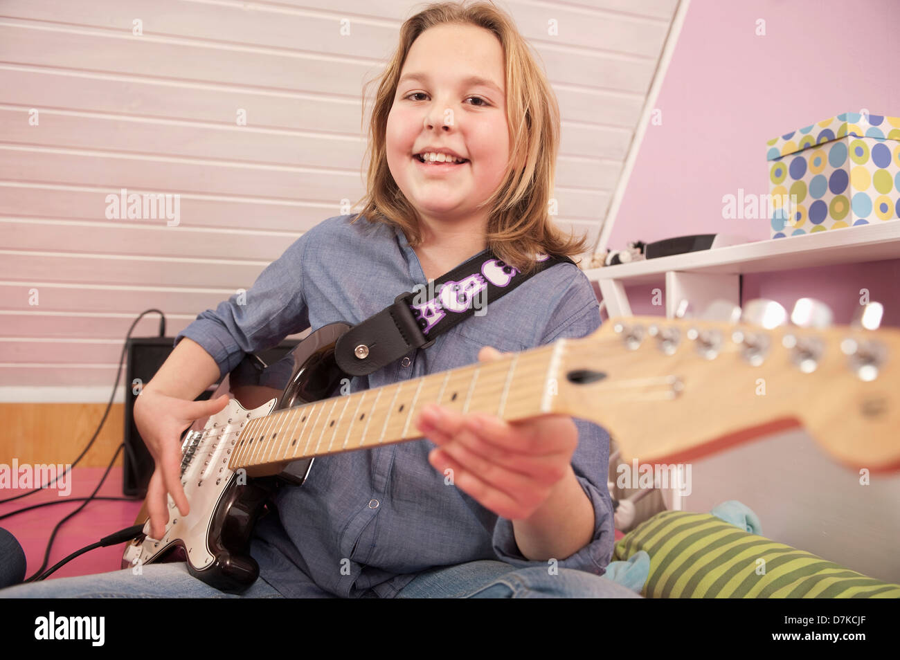 Girl playing guitar, smiling, portrait Stock Photo - Alamy