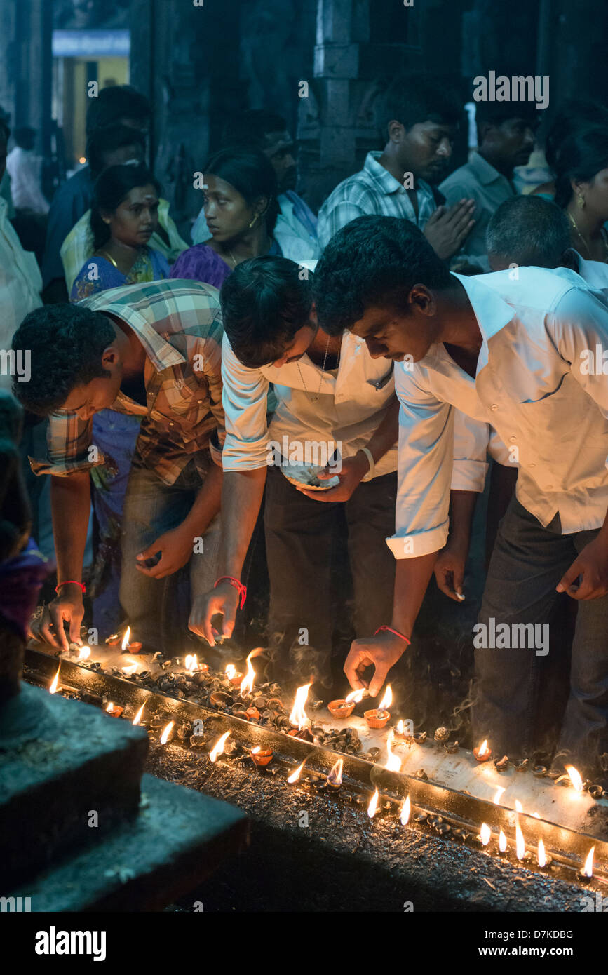 Indian family praying hi-res stock photography and images - Alamy