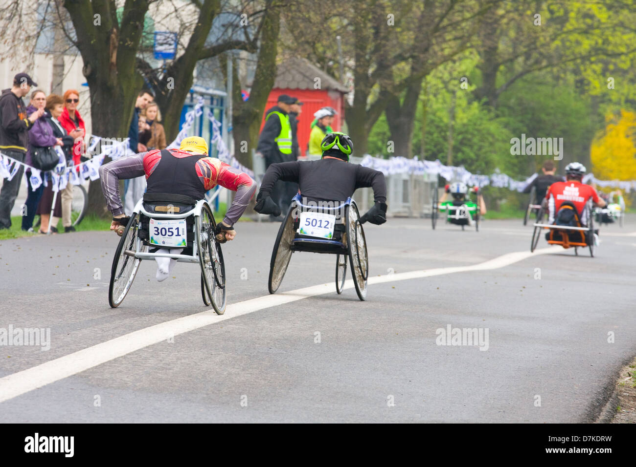 Cracovia Marathon.Handicapped man marathon runners in a wheelchair on ...