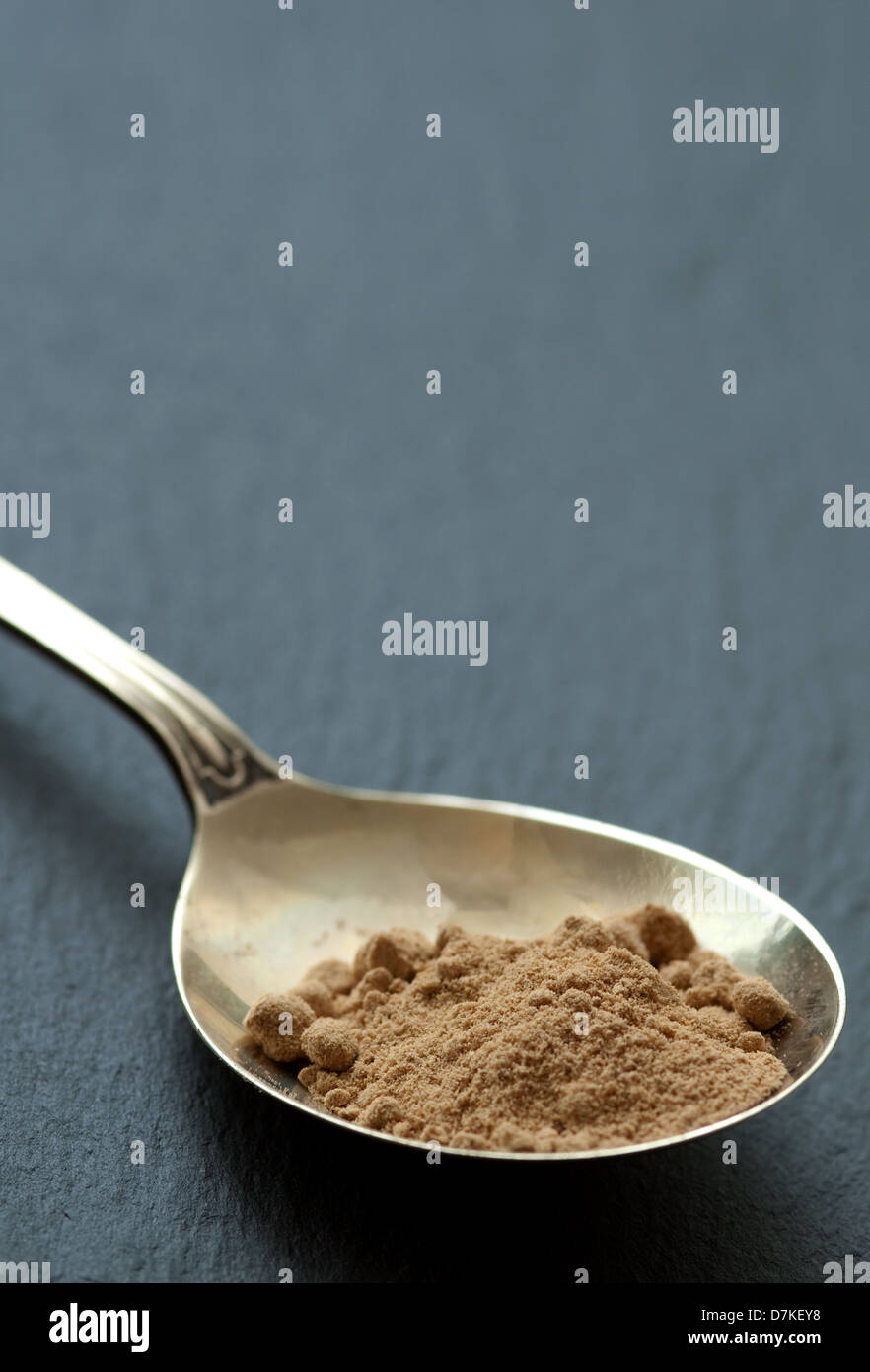 Still life food image of ground ginger on a spoon Stock Photo - Alamy