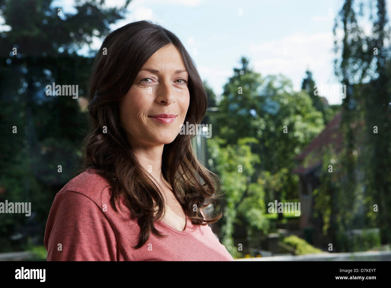 Germany, Berlin, Mature woman smiling, portrait Stock Photo - Alamy