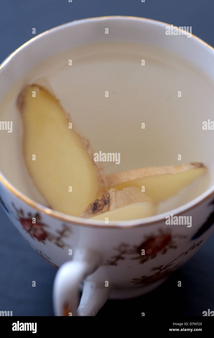 Still life image of a teacup with ginger infusion Stock Photo - Alamy
