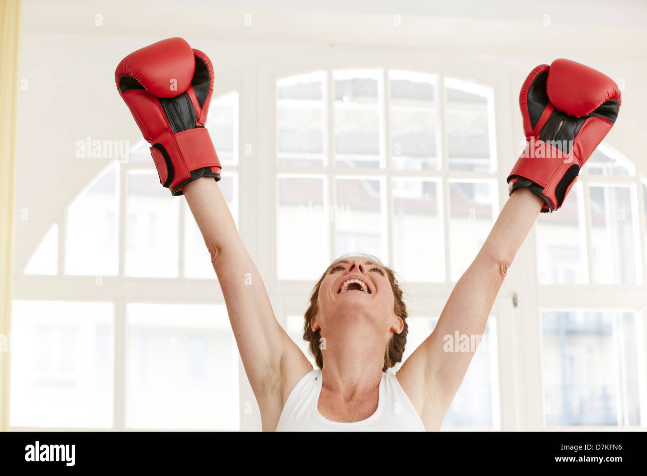 Germany, Duesseldorf, Mature woman with boxing glove Stock Photo - Alamy